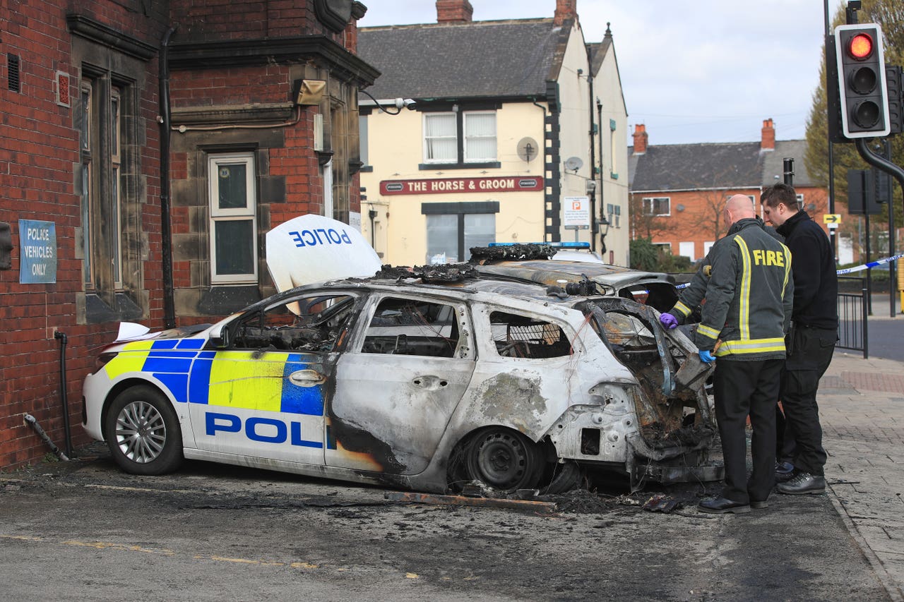 Two patrol cars wrecked in arson attack outside police station | News ...