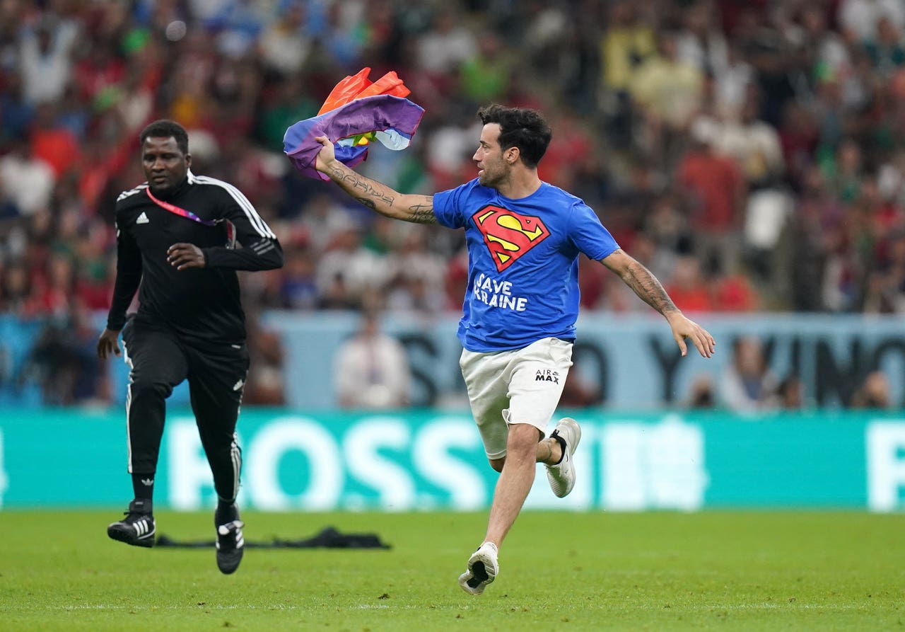 Qatar pitch invader who carried rainbow flag says he will not face ...