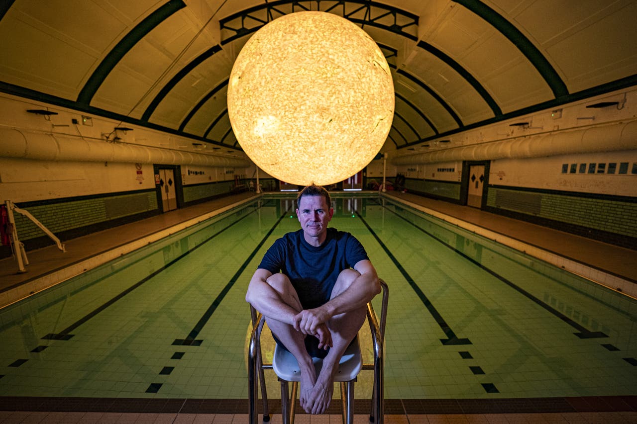 Sun artwork suspended above water at community swimming pool | Hexham ...