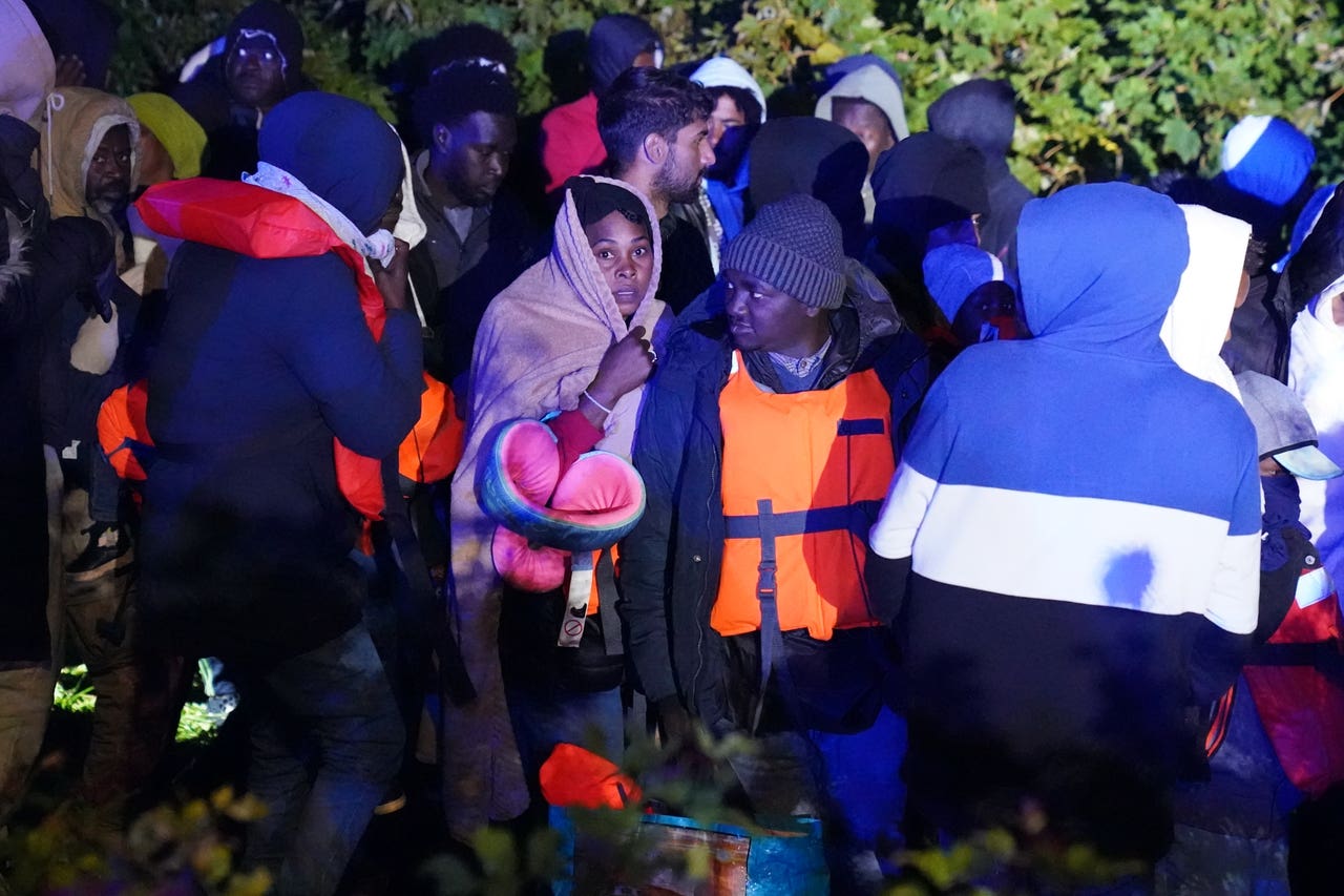Riot police stop migrants from reaching beach in French town | Ilkley ...