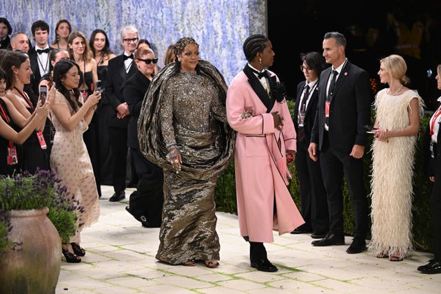 Kim Kardashian stuns Met Gala in tangerine breastplate by British ...
