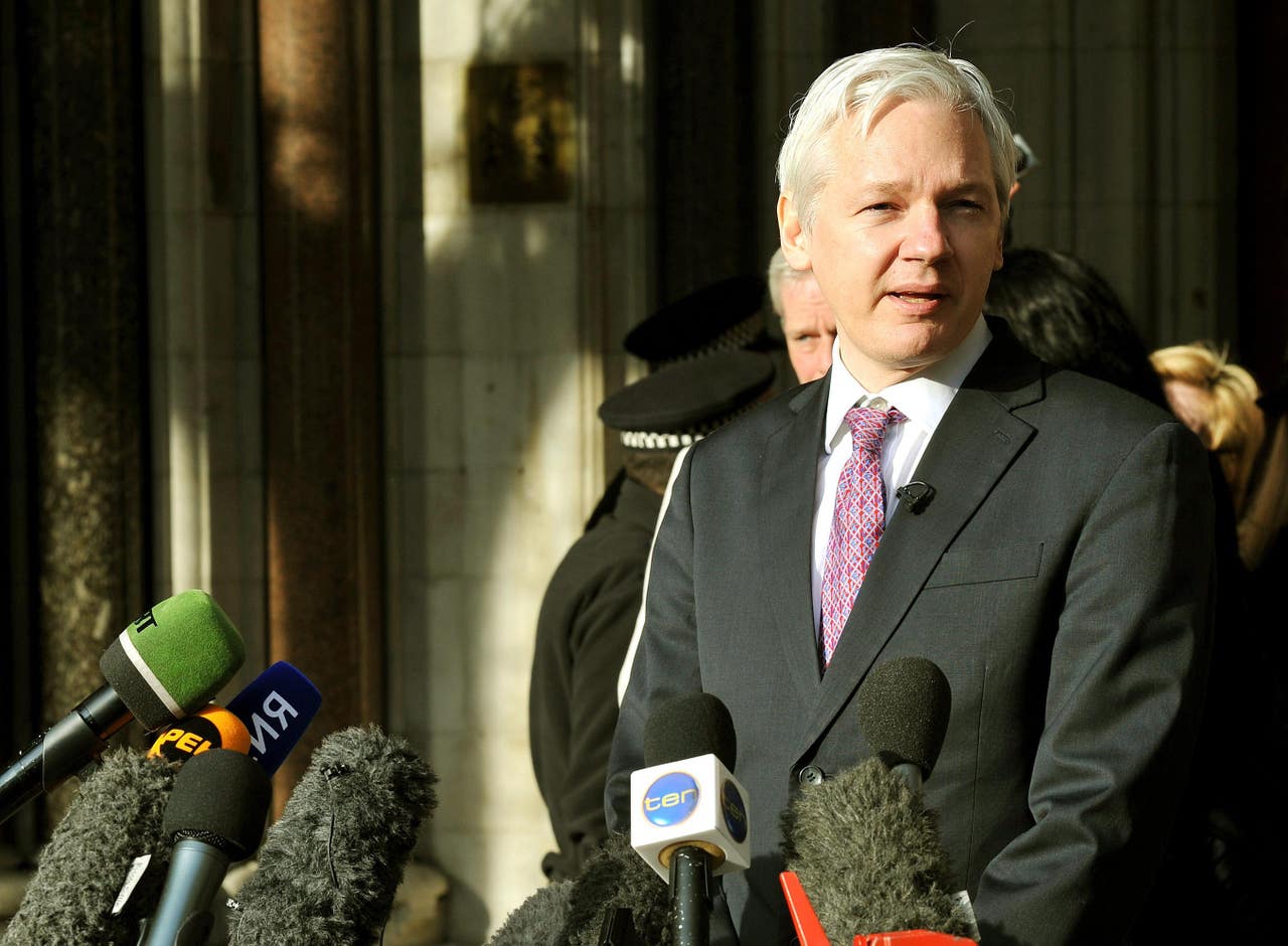 Julian Assange supporters hold vigils to mark arrest anniversary ...