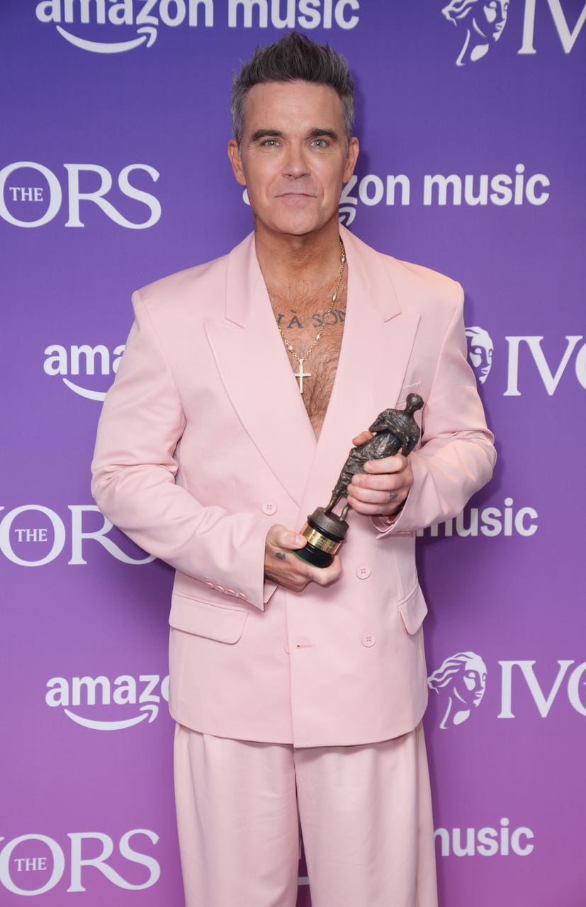 Robbie Williams says he would open for Oasis despite decades-long ...