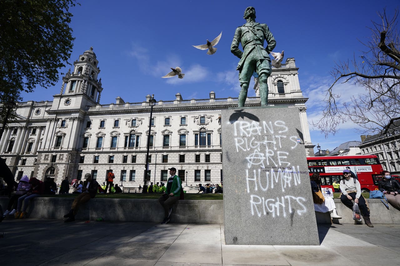 Police investigate after statues daubed with graffiti during trans ...