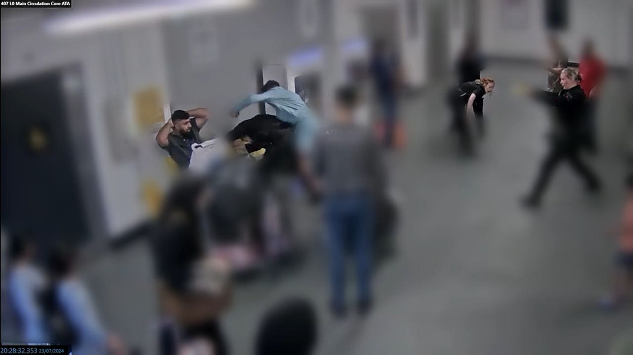 Jury shown CCTV footage of alleged assault on police at Manchester ...