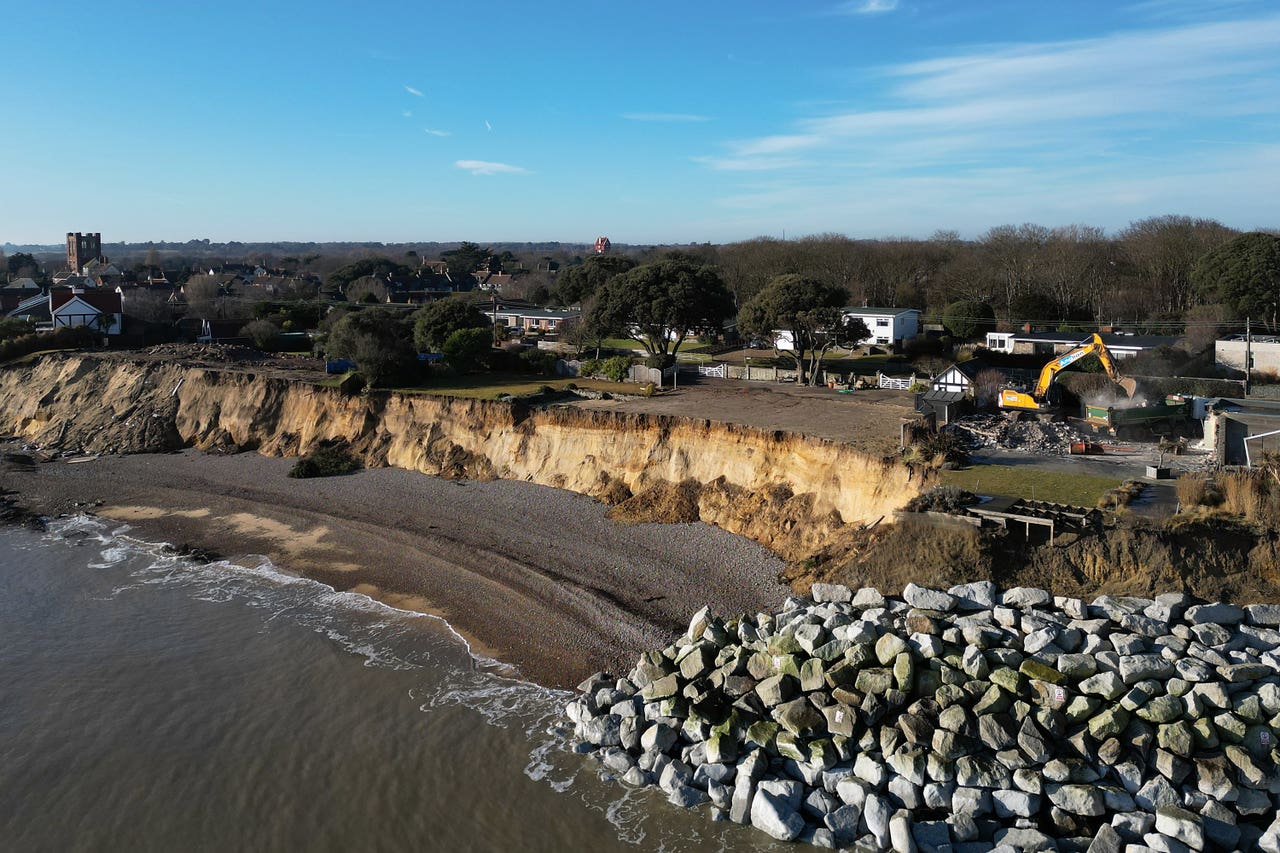 Aerial images show demolition of fourth clifftop home amid coastal ...