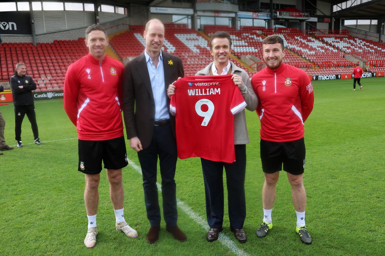 William downs shot and pulls pint during Wrexham football club visit ...
