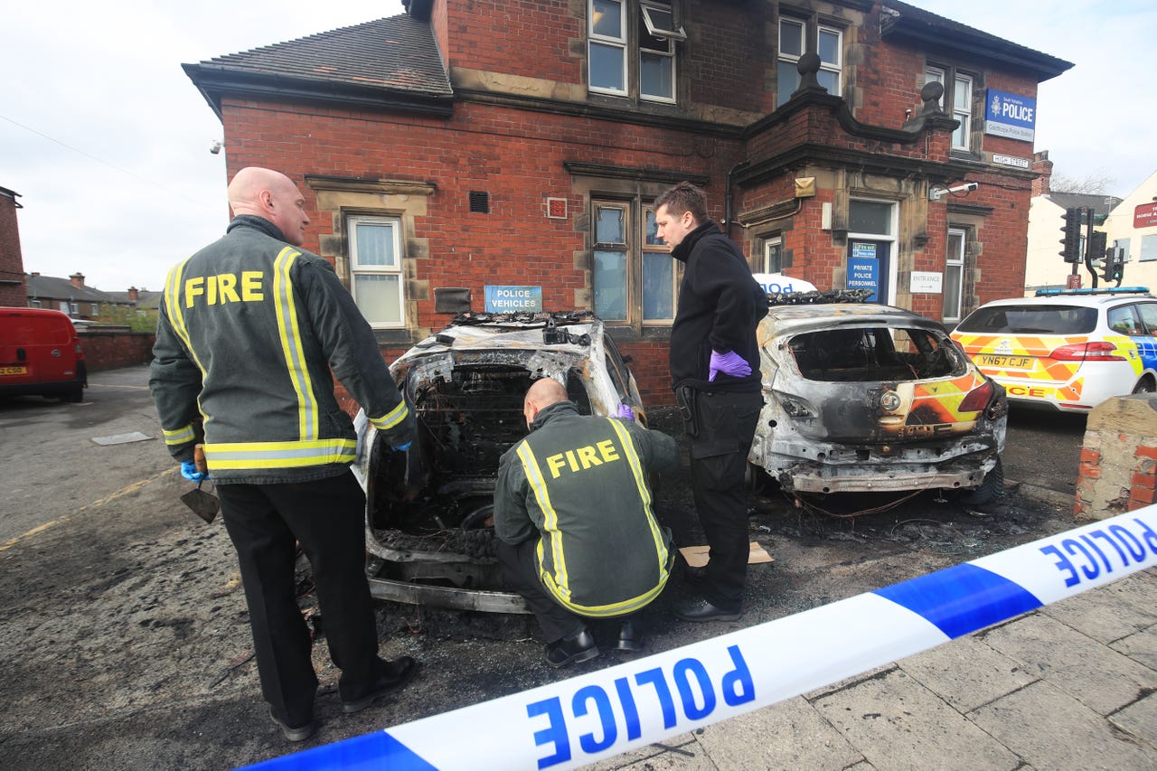 Two patrol cars wrecked in arson attack outside police station | News ...