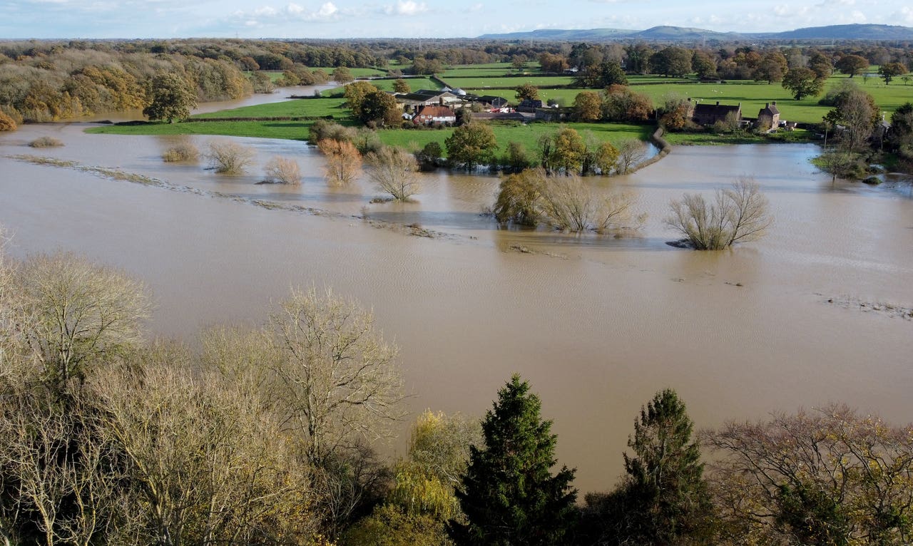 In pictures: ‘Atrocious’ weather as band of rain travels across the UK