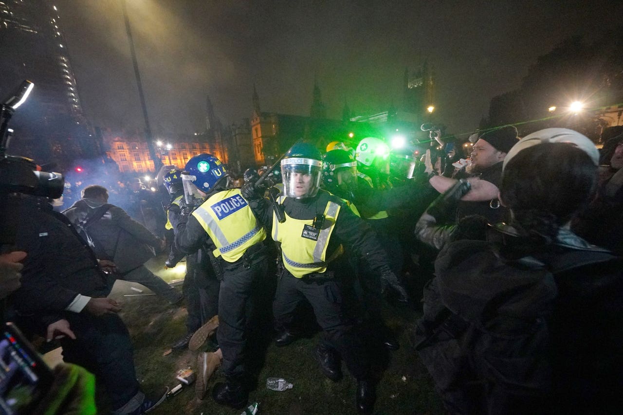 Twelve arrests as mask-wearing protesters clash with police on Bonfire ...