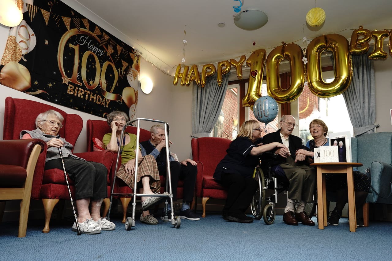 Wartime hero who saved famed building grins as he is honoured on 100th ...