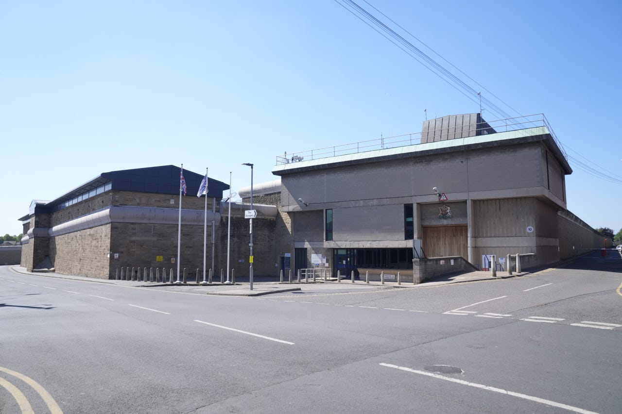 Two men in court charged with prison murder of disgraced rock star Ian ...