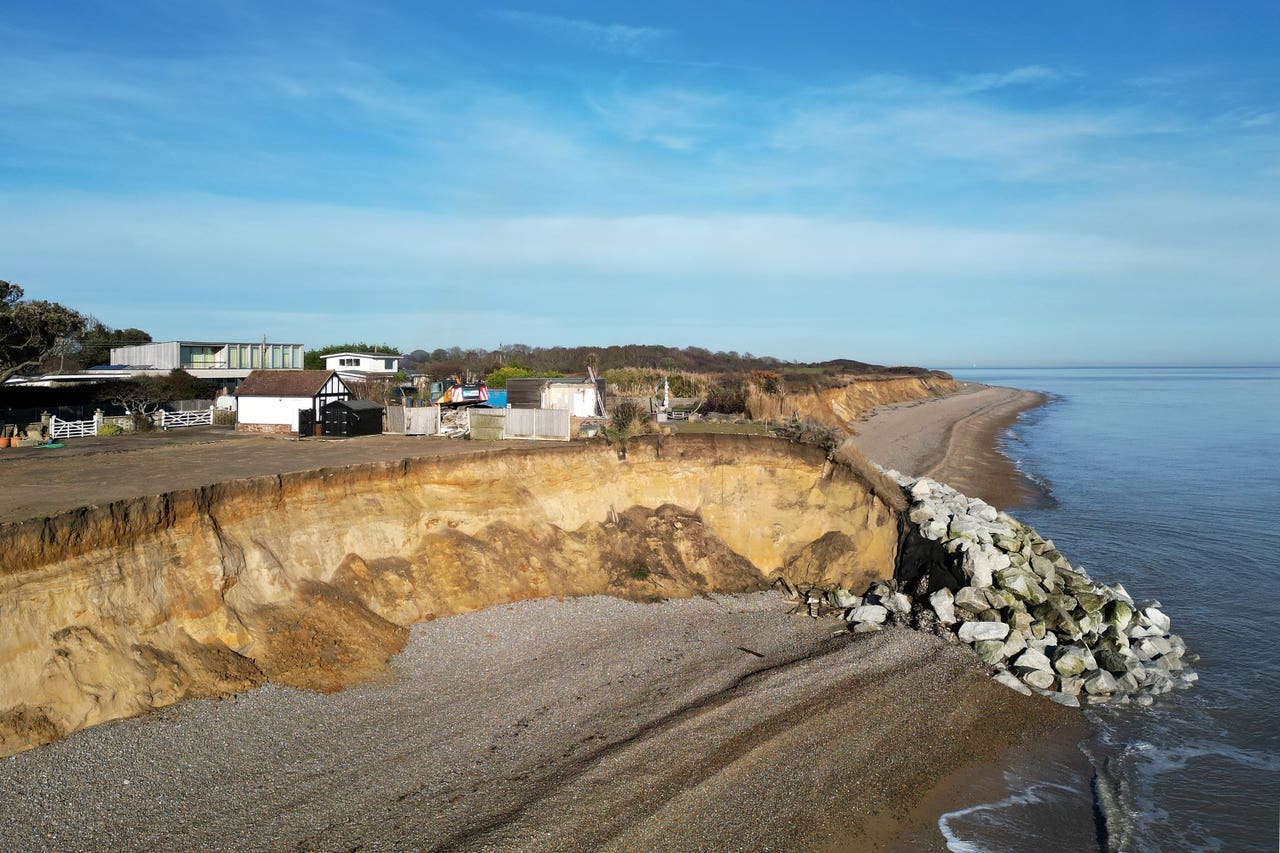 Aerial images show demolition of fourth clifftop home amid coastal ...