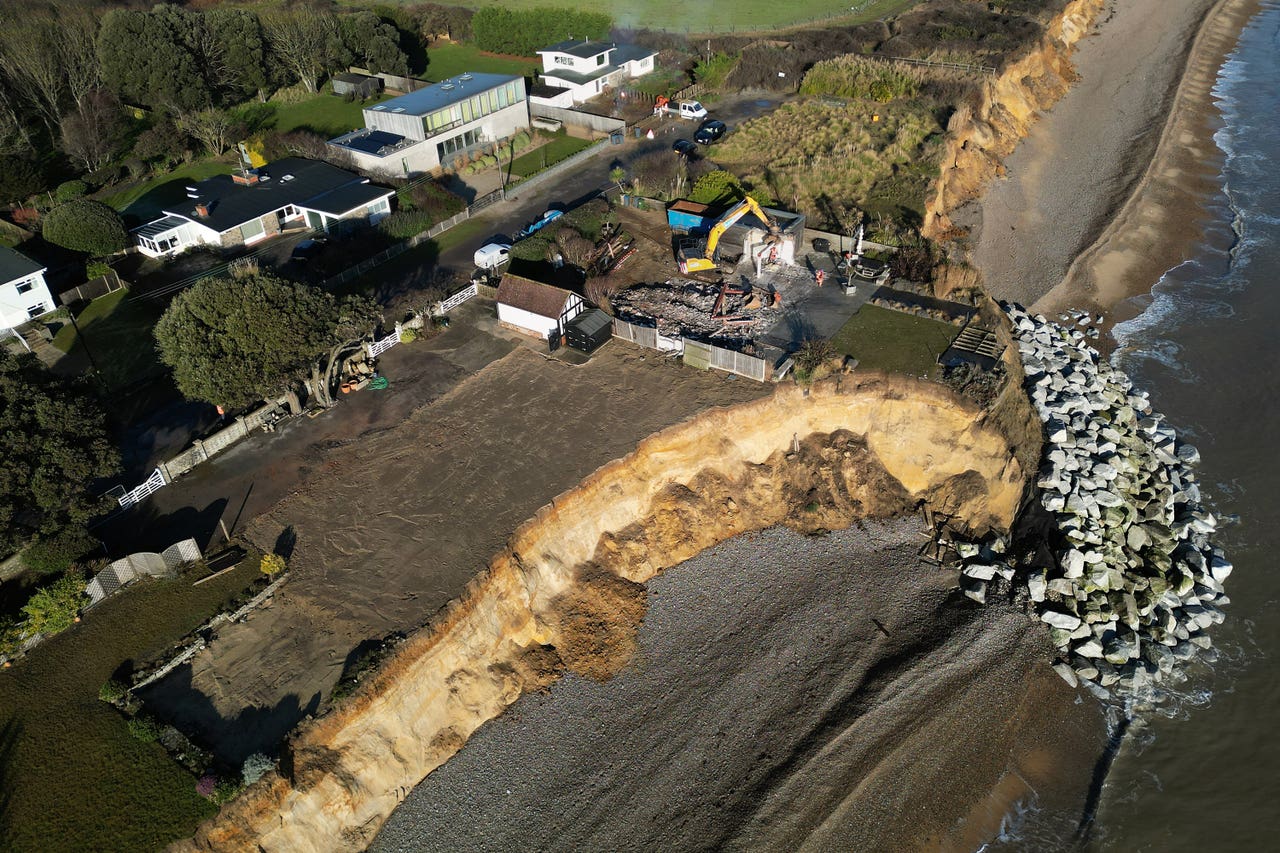 Aerial images show demolition of fourth clifftop home amid coastal ...