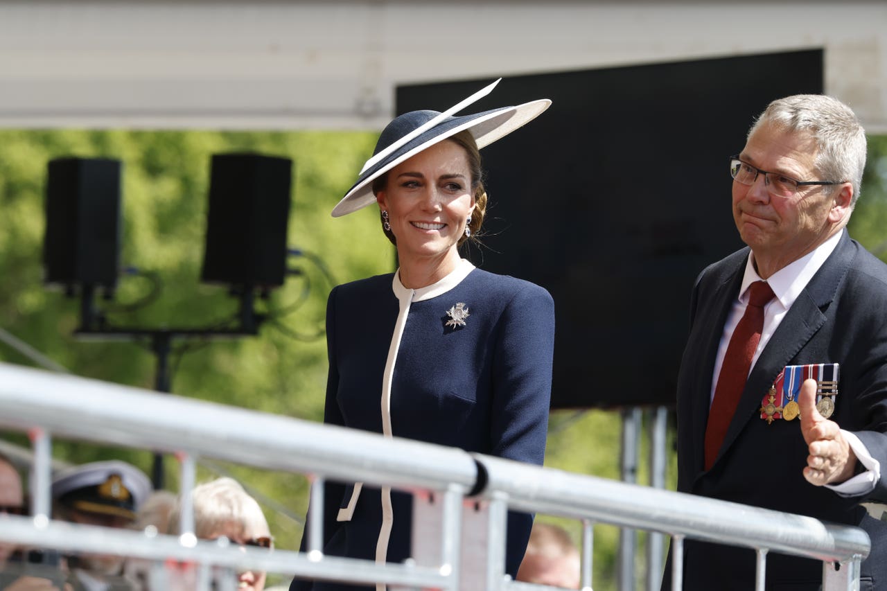 Kate names Royal Navy warship by smashing bottle of whisky against hull ...