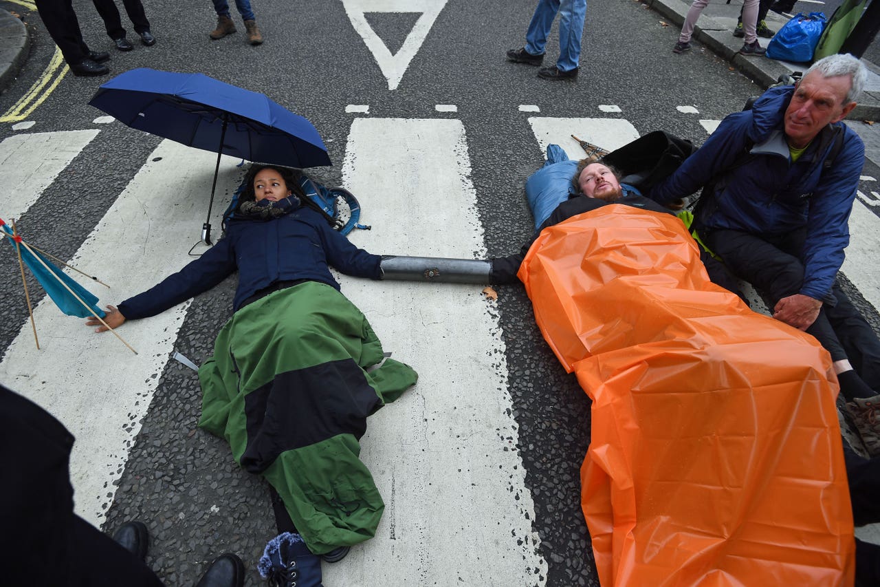 Climate protesters block roads in London and across Europe to demand ...