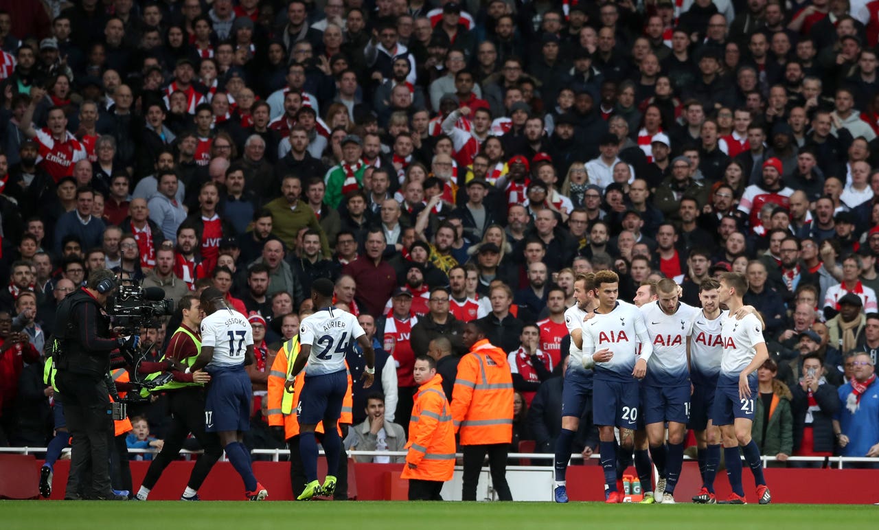 Arsenal triumph over Tottenham amid 'unacceptable' trouble in stands ...