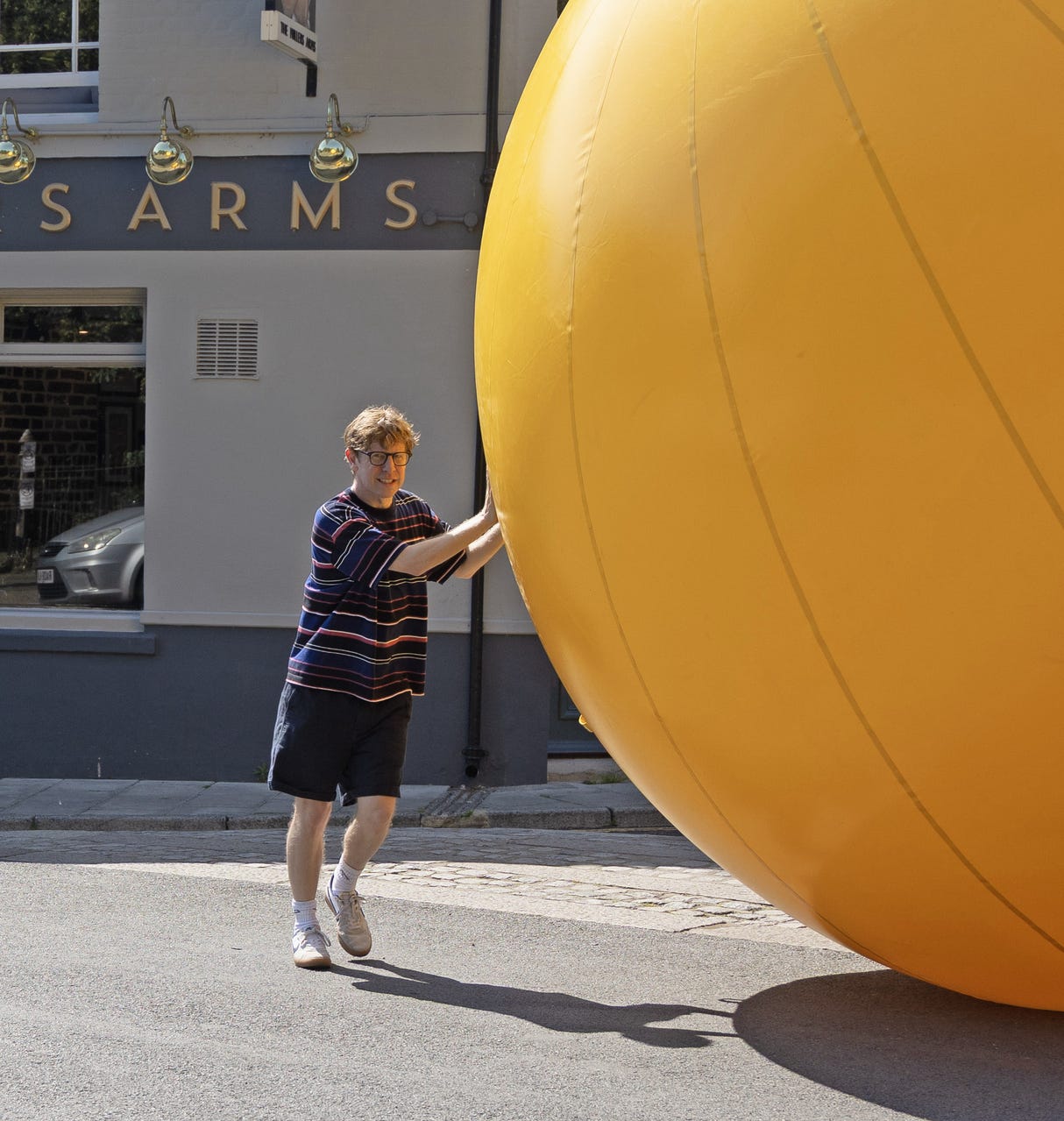 Josh Widdicombe wrangles giant yellow ball on to boat for new TV show ...