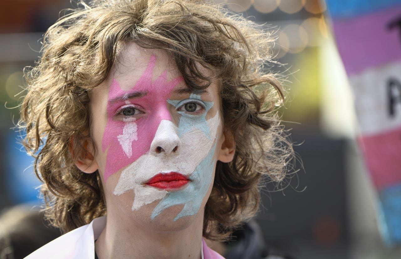 Police investigate after statues daubed with graffiti during trans ...