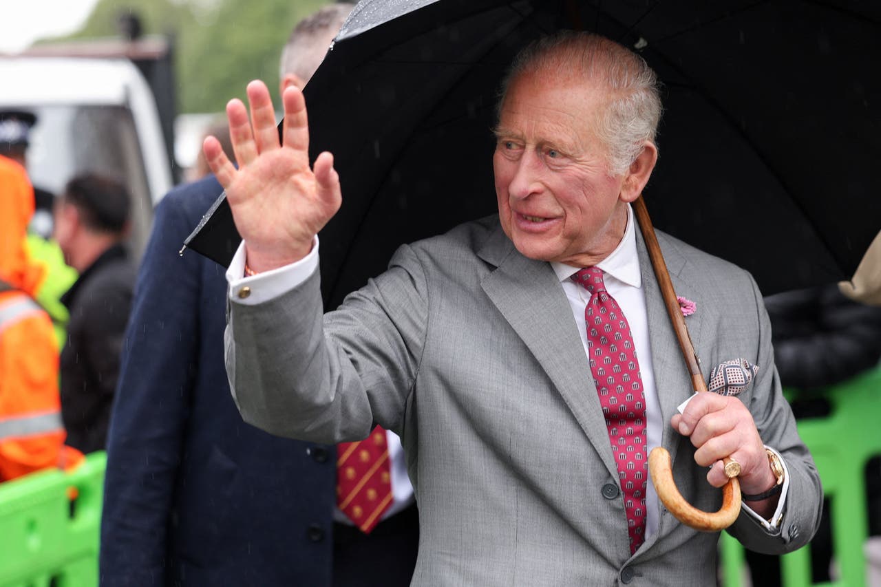 Charles braves downpour to meet football club’s mascot | Border ...