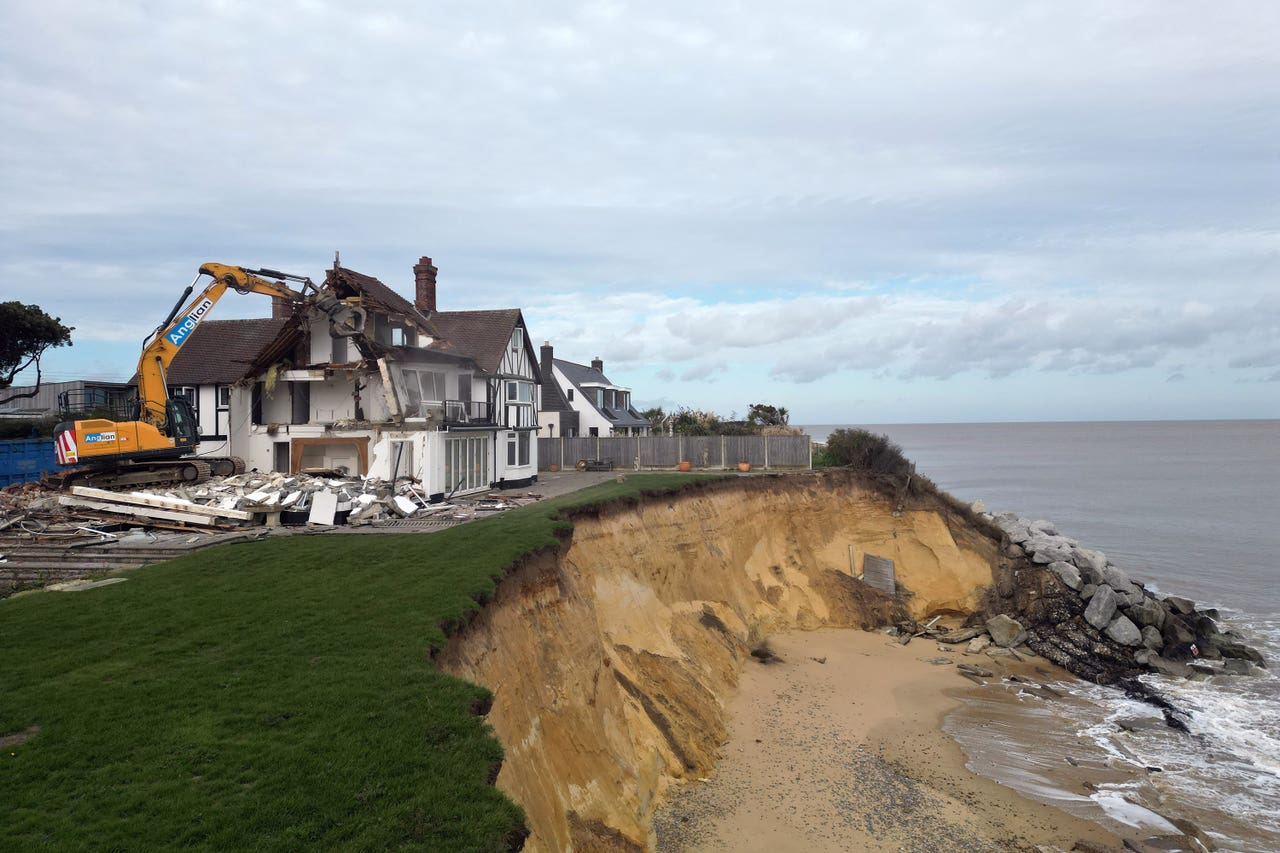 Demolition of clifftop home threatened by coastal erosion under way
