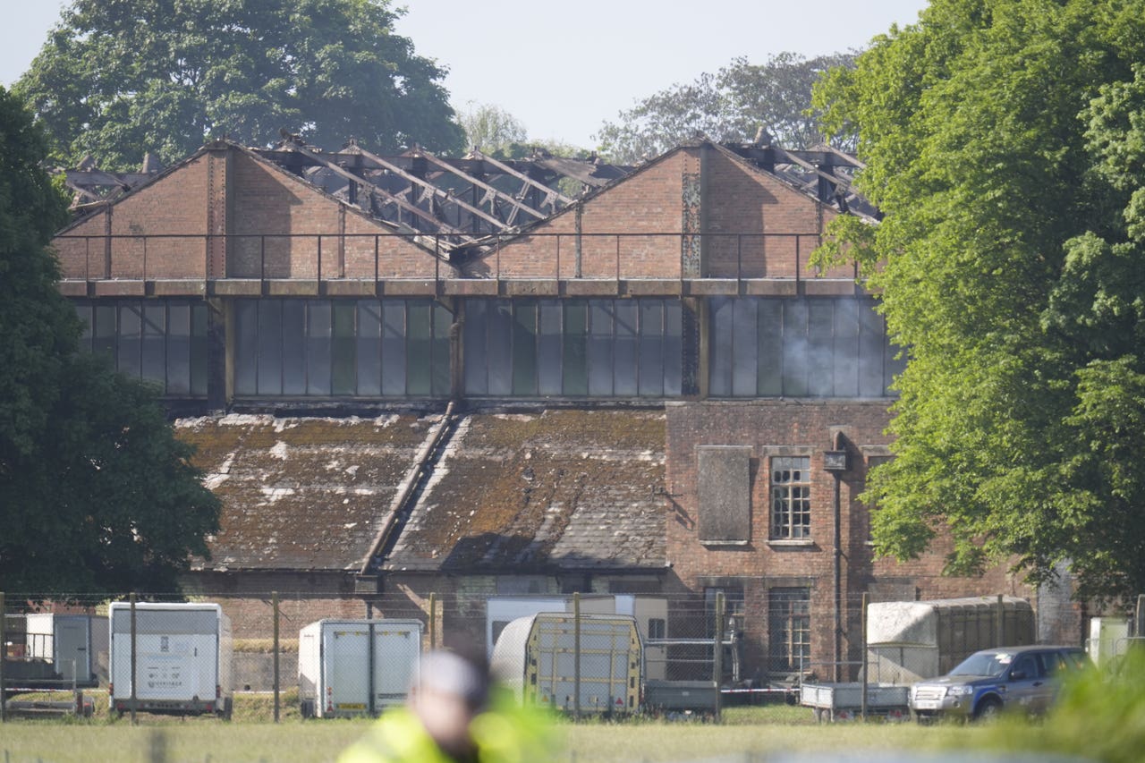 Tributes left at ex-RAF base where fire killed firefighters and member ...
