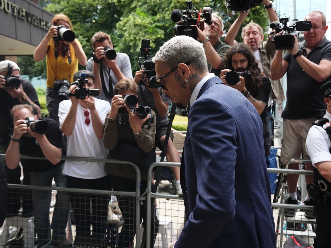 Chris Brown arrives at court to enter plea over ‘bottle attack’ charge ...