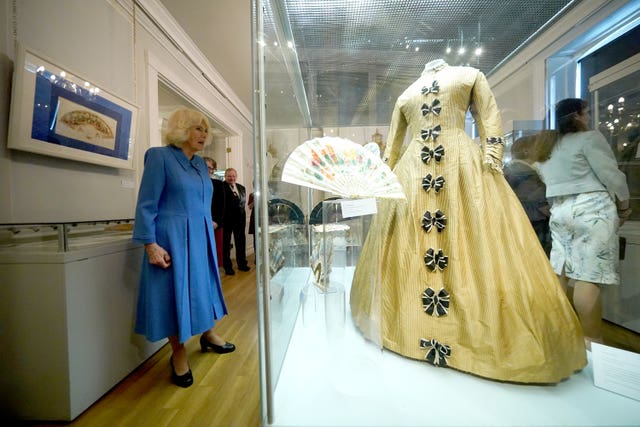 Camilla given fan from coronation portrait on visit to museum’s new ...
